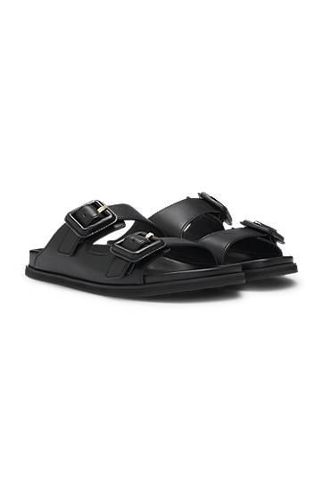 Leather slides with twin buckled straps – Omdömen - Hållbarhet